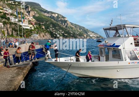 Tourists boarding a small boat at Positano, Amalfi coast, Italy Stock ...
