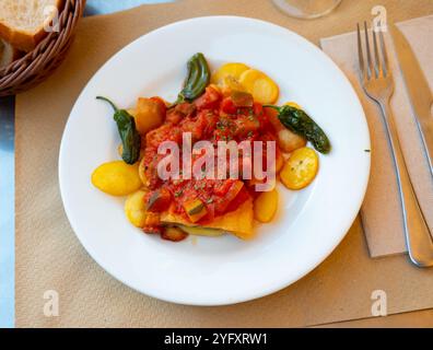 Spanish dish cod with sanfaina, sauteed vegetables and tomato sauce ...