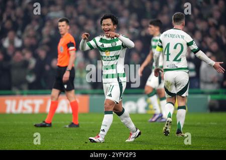 Celtic's Reo Hatate (centre) celebrates with Kieran Tierney (left ...