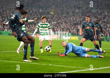 Celtic's Reo Hatate (left) scores his sides first goal during the ...
