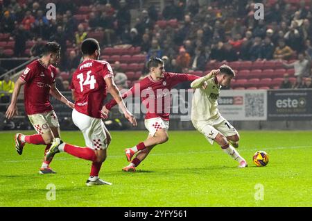 Sheffield United's Harrison Burrows (right) scores a goal that is ...