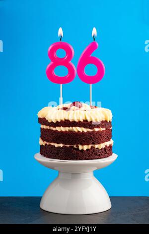 Candle number 86 - Cake birthday in rhodamine red background Stock ...