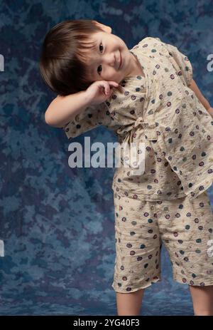A 2-year-old child in a jinbei making a cute gesture Stock Photo - Alamy