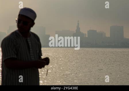 Foggy day in Doha People walk along the Doha Corniche in heavy fog on ...