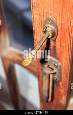 Old-fashioned screw window locks Stock Photo - Alamy