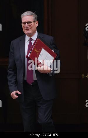 Conservative Party leader Kemi Badenoch is seen on a TV screen ...