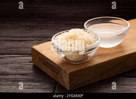 Cocos nucifera - Organic coconut water in glass bowl Stock Photo - Alamy