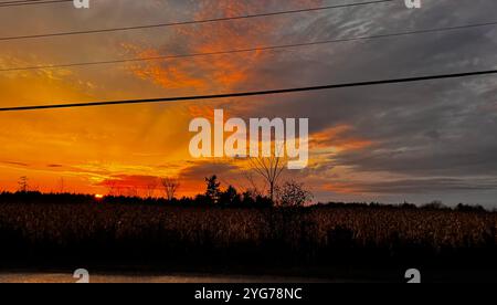 sunset with clouds over field at autumn Stock Photo - Alamy