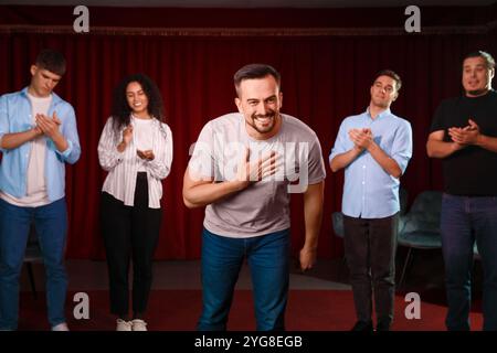 Professional actors bowing on stage in theatre, closeup Stock Photo - Alamy