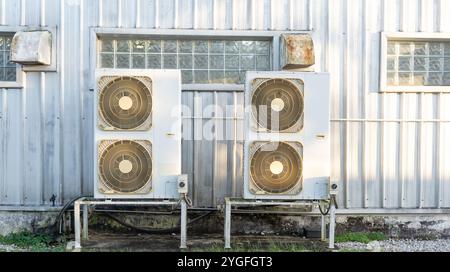 Air conditioner compressor units installed outside Stock Photo - Alamy