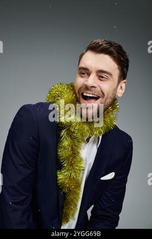 The young man shows a playful expression while playfully stretching his ...