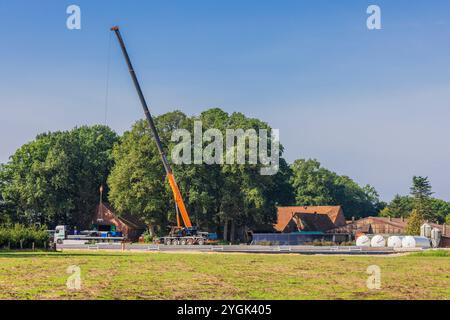 Rural construction. Building a stable base within grazing paddocks ...