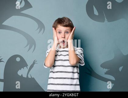 Boy scared of monsters, teraphobia. Creepy shadow attacking him Stock ...