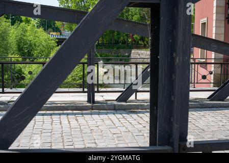 A bridge in Klodzko spanning the Nysa river, featuring elegant arches ...