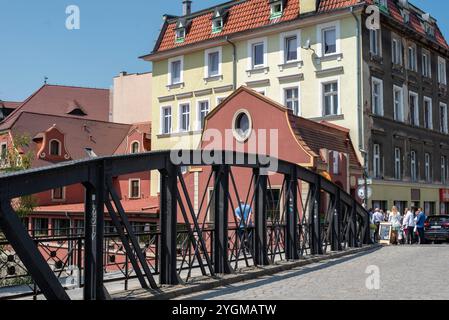 A bridge in Klodzko spanning the Nysa river, featuring elegant arches ...