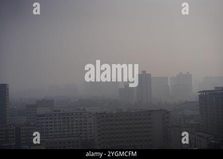 Buildings are faintly visible in the haze in Fuyang City, Anhui ...