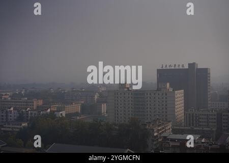 Buildings are faintly visible in the haze in Fuyang City, Anhui ...