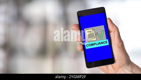 Smartphone screen displaying a compliance concept Stock Photo - Alamy