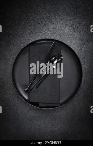 Perspective view of empty black plate on wooden background. Empty space ...