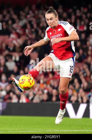Arsenal's Caitlin Foord scores her side's fourth goal during the women ...