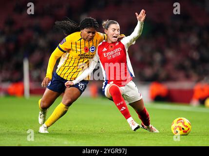 Brighton and Hove Albion's Madison Haley heads the ball clear under ...
