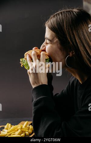 Savoring a Delicious Burger With Crispy Fries and a Refreshing Drink on ...