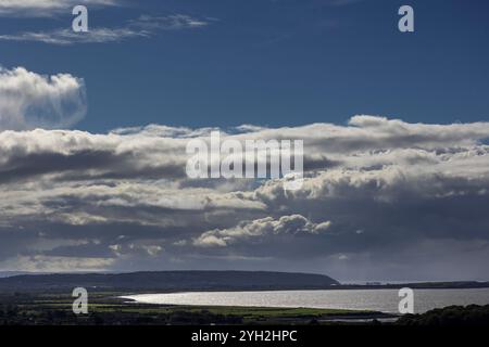 Squally weather over the Severn estuary with cumulus clouds and blue ...
