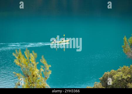 Two People Canoeing in the cyan waters of Lake Esparron in the Gorges ...