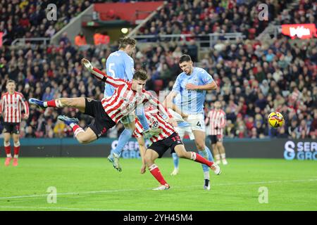 Coventry City's Jack Rudoni (second from right) scores their side's ...