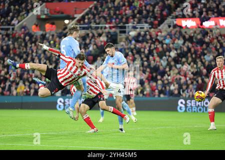 Coventry City's Jack Rudoni (second from right) scores their side's ...