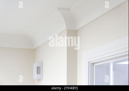 Coving installation painted white in new house Stock Photo - Alamy