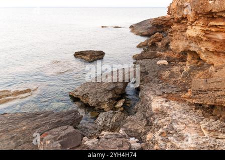 Rock formations on the coast of the wavy sea Stock Photo - Alamy