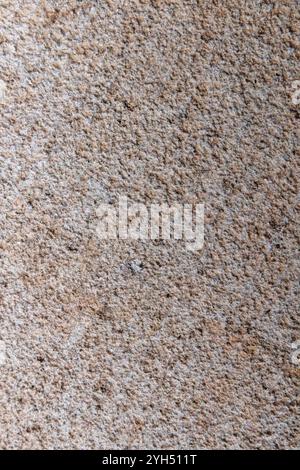 Close up photo of a granulated concrete rock texture split with ...