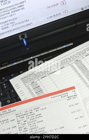 TAN list and account statement lying on a PC keyboard, Federal Republic ...