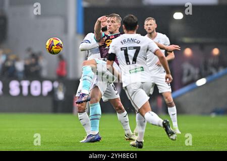 Zian Flemming of Burnley under pressure from Dimitris Goutas of Cardiff ...