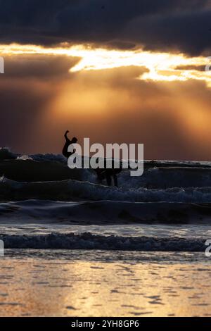 Seaside at dawn in french atlantic coast with surfers Stock Photo - Alamy