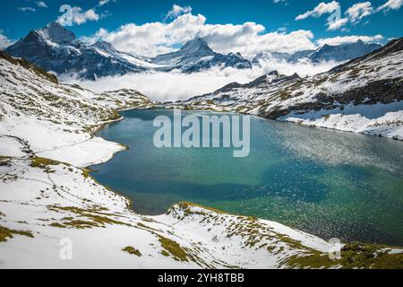 Winter alpine scenery with valley lake and snowy peaks, panoramic shot ...