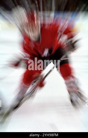 ice hockey player in action kicking with stick Stock Photo - Alamy