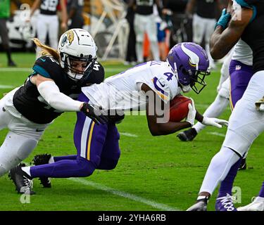 Minnesota Vikings wide receiver Brandon Powell (4) is tackled by ...