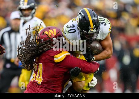 Washington Commanders defensive tackle Sheldon Day (64) warms up before ...