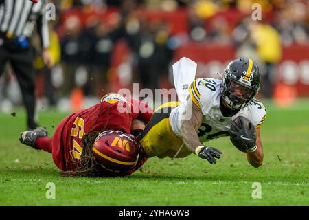 Washington Commanders defensive tackle Sheldon Day (64) warms up before ...