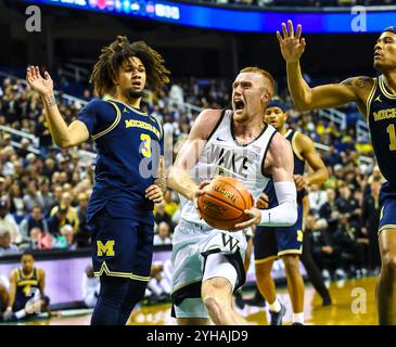 Michigan guard Tre Donaldson drives to the basket against Oklahoma ...