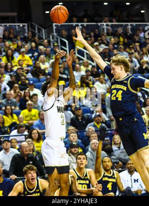 Michigan forward Will Tschetter (42) points after making a 3-point shot ...