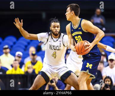 Michigan center Vladislav Goldin (50) drives against Northwestern ...
