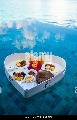 Floating breakfast in a heart shape in the pool in Maldives Stock Photo ...