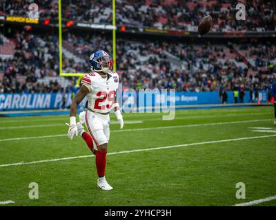 New York Giants' Tyrone Tracy Jr., left, tries to get past Philadelphia ...