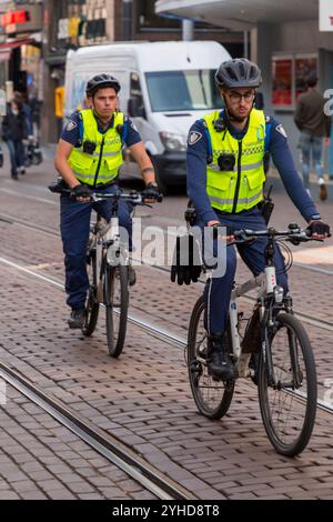 Dutch police officers on bike in Amsterdam, Netherlands Stock Photo - Alamy