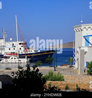 The Monet small cruising ship moored at Livadia Harbour, Tilos Island ...