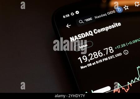 In this Photo illustration, a NASDAQ logo seen displayed on a ...