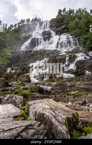 A stunning multi-tiered waterfall cascades down rocky cliffs in Ella ...